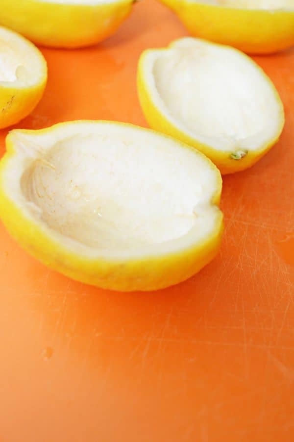 Strawberry Lemonade Jello Shots With Vodka Served In Lemon Wedges