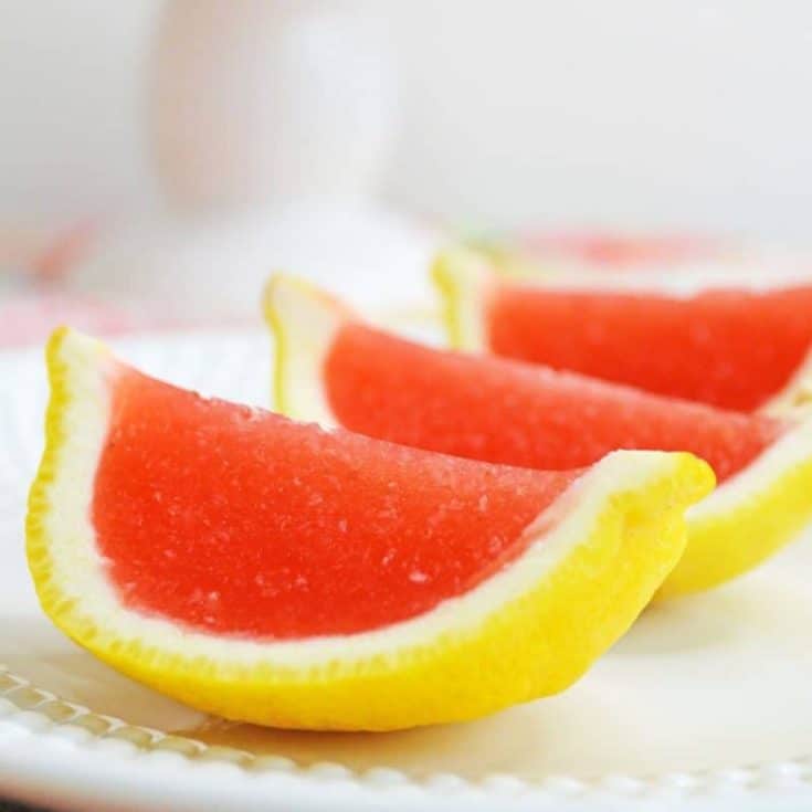 Strawberry Lemonade Jello Shots With Vodka Served In Lemon Wedges